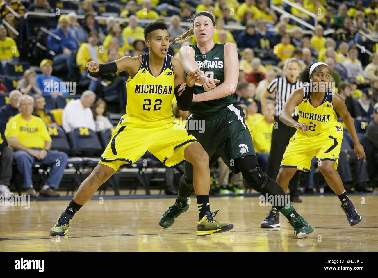 Michigan forward Cyesha Goree (22) and Michigan State forward Becca ...