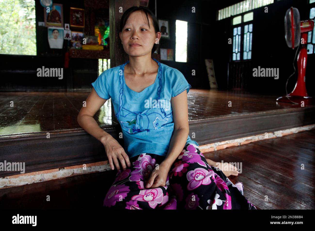 In this photo taken on Nov. 7, 2014, survivor Khin Htway Yee, who was with her friend May Aye ...