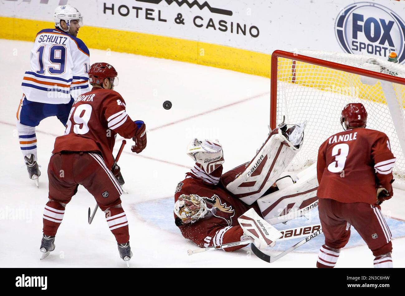 Edmonton Oilers' Justin Schultz (19) has his shot blocked by Arizona ...