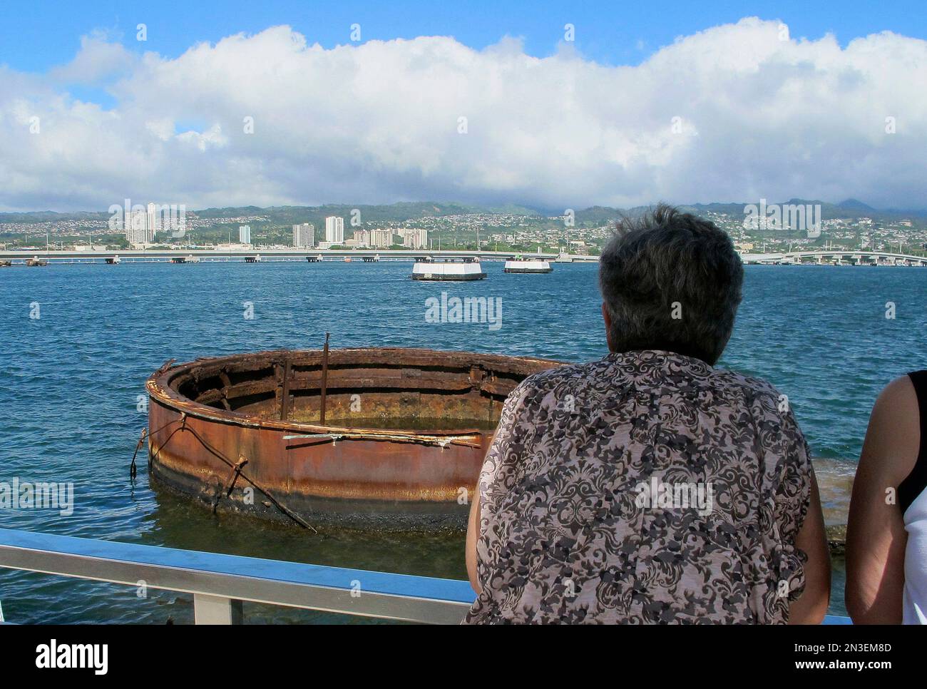 This Nov. 21, 2014 photo shows visitors looking out at the sunken USS ...