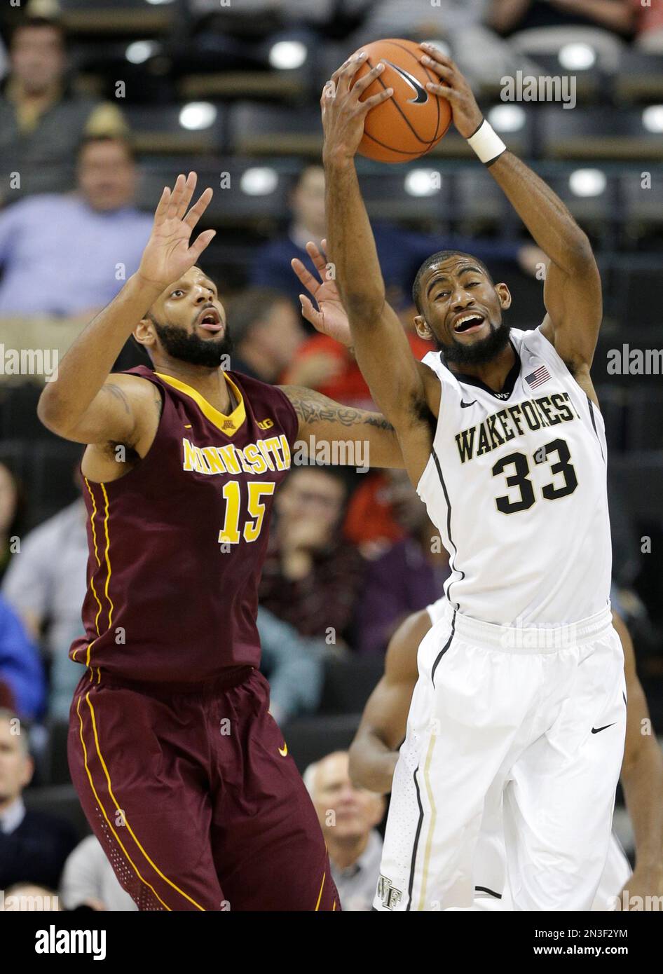 Wake Forest's Aaron Rountree III (33) grabs a rebound over Minnesota's ...