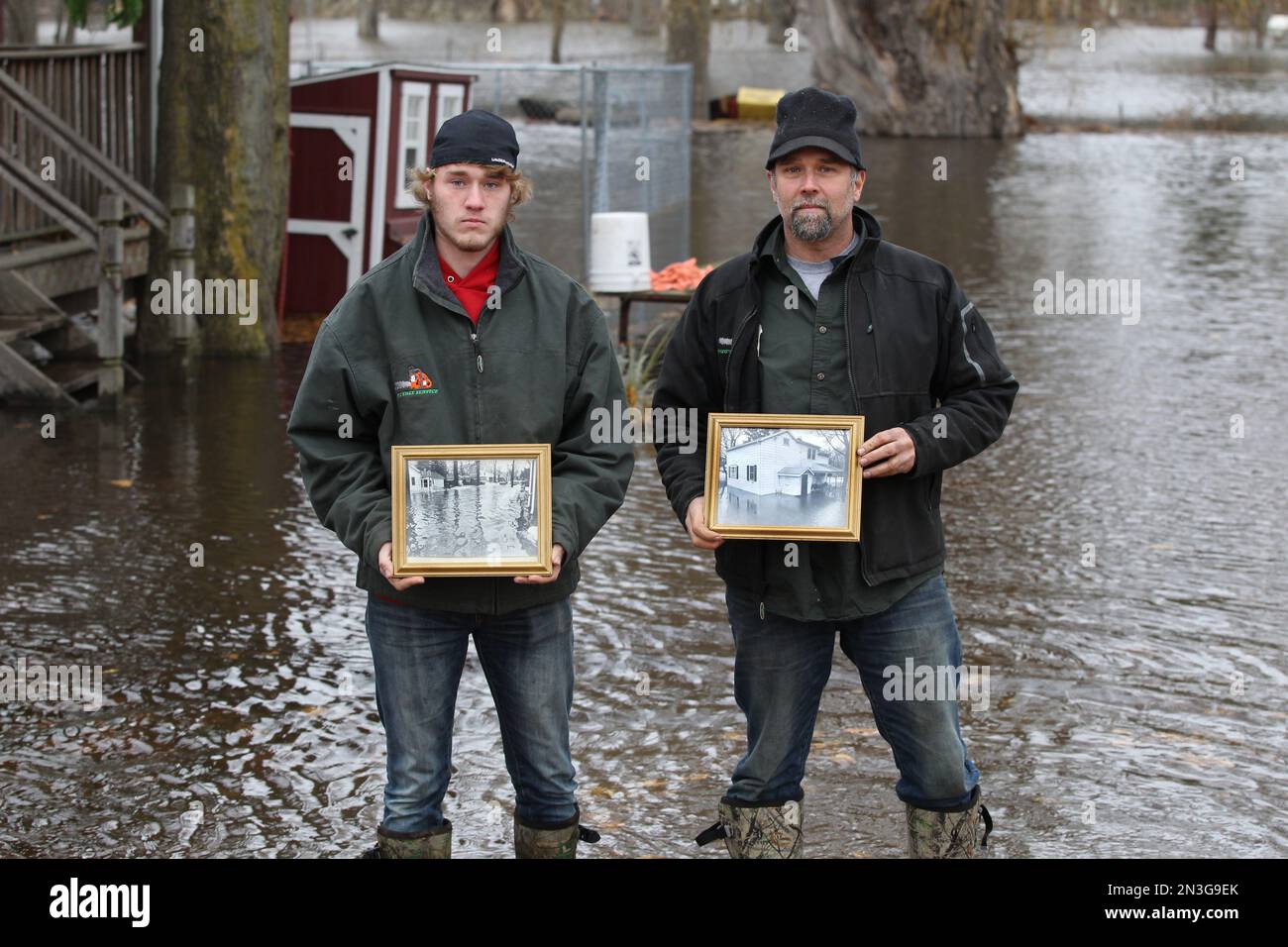 Jake Sojka, left, and his father Gregory Sojka, pose with photos from ...