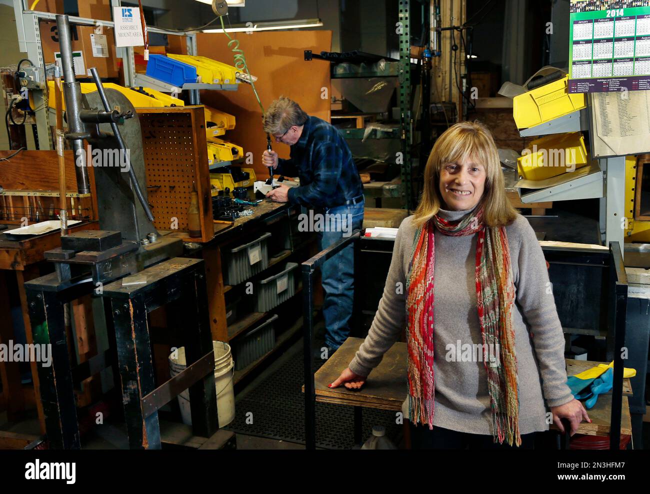 Judy Solomon, vice president of Kinetic Systems Inc., poses for photos ...