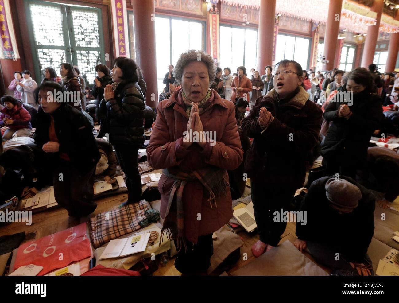 Parents pray to wish for their children' success in the Scholastic ...