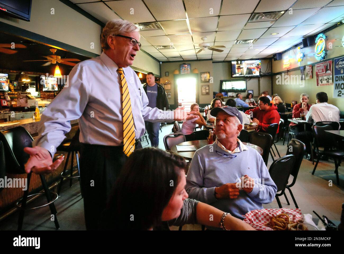 Democratic House candidate Brad Ashford, left greets the public at ...