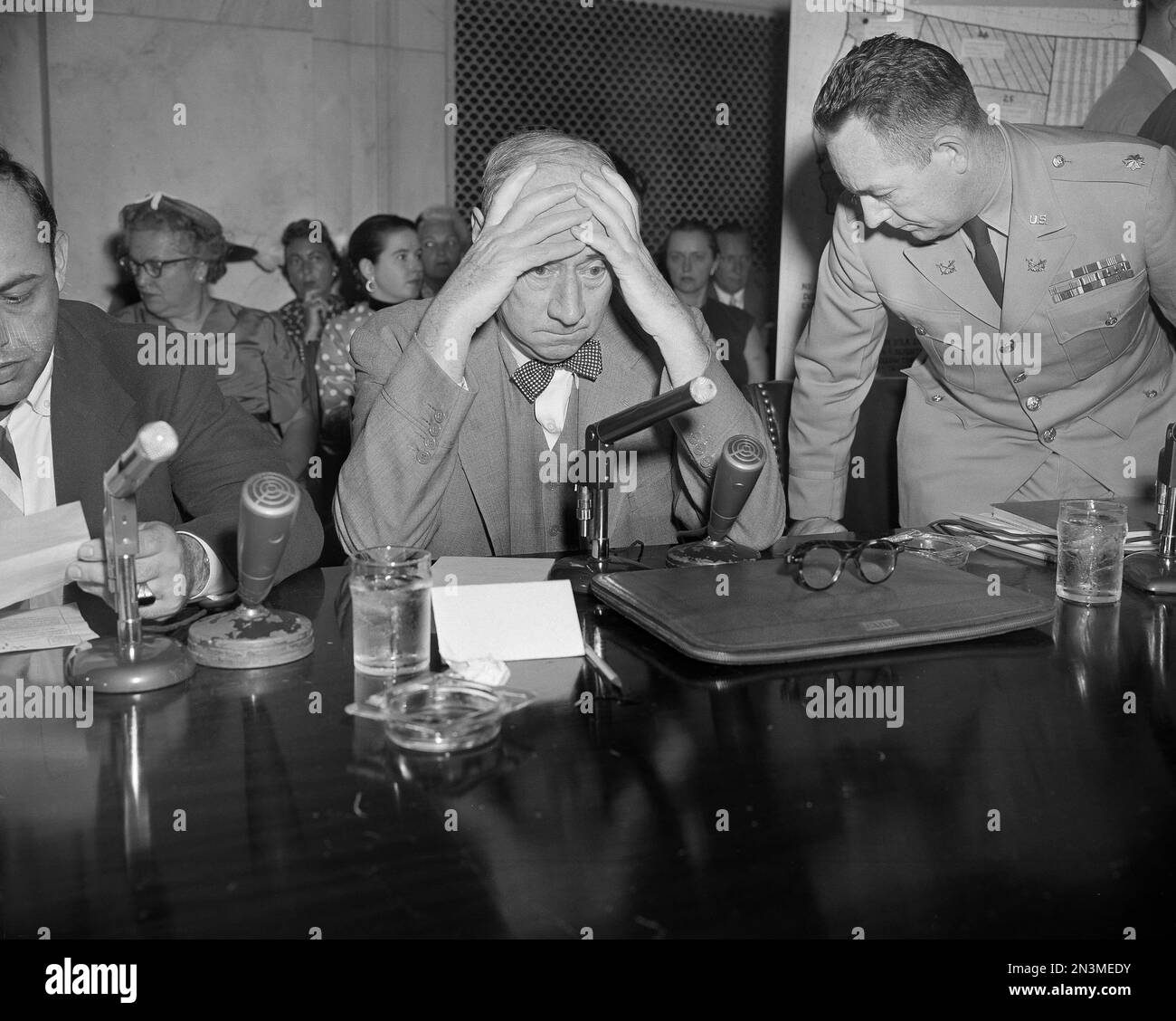 Army Special Counsel Joseph Welch sits with his hands to his forehead ...