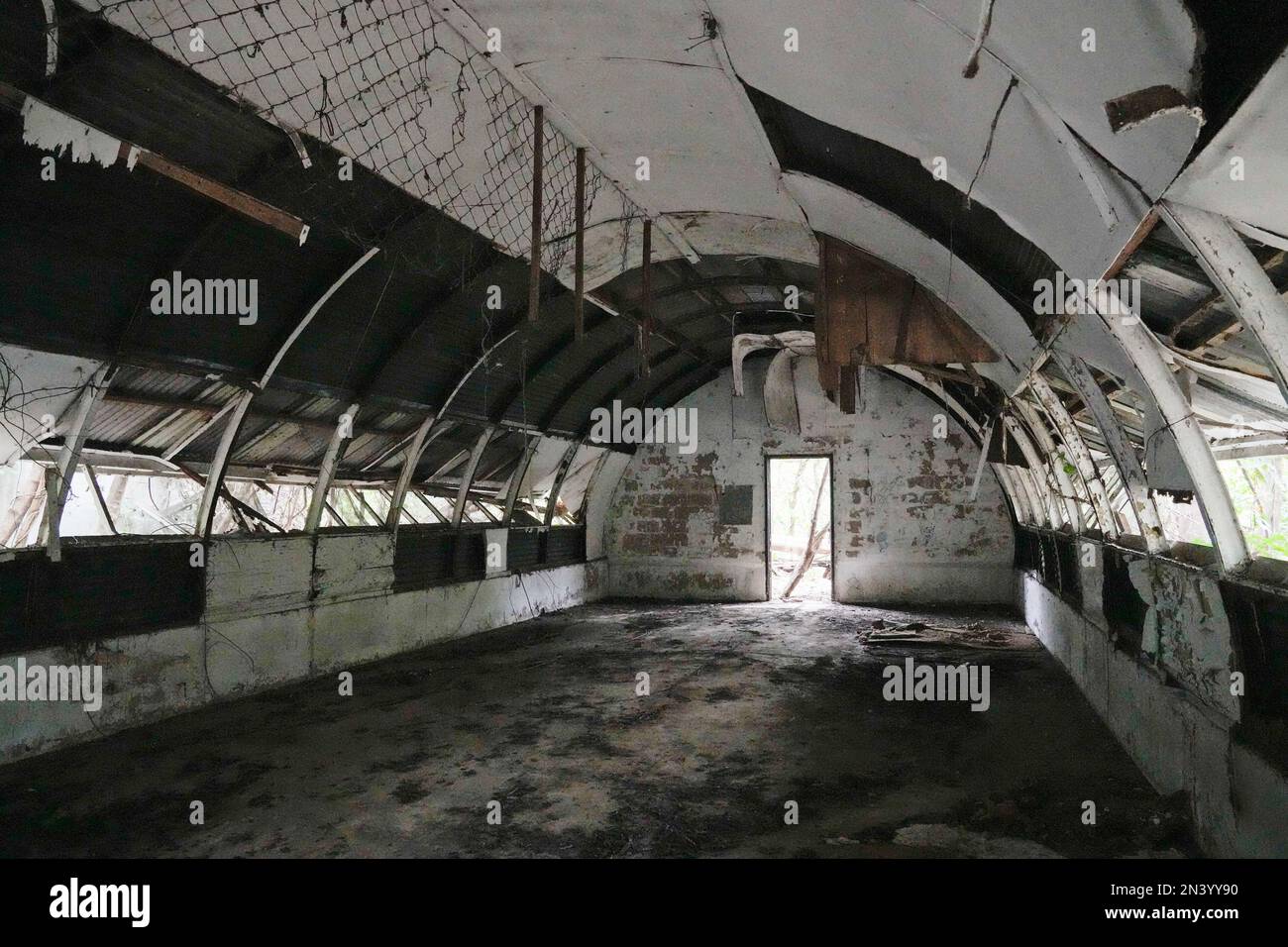 This photo shows abandoned concrete structures called "Quonset huts ...