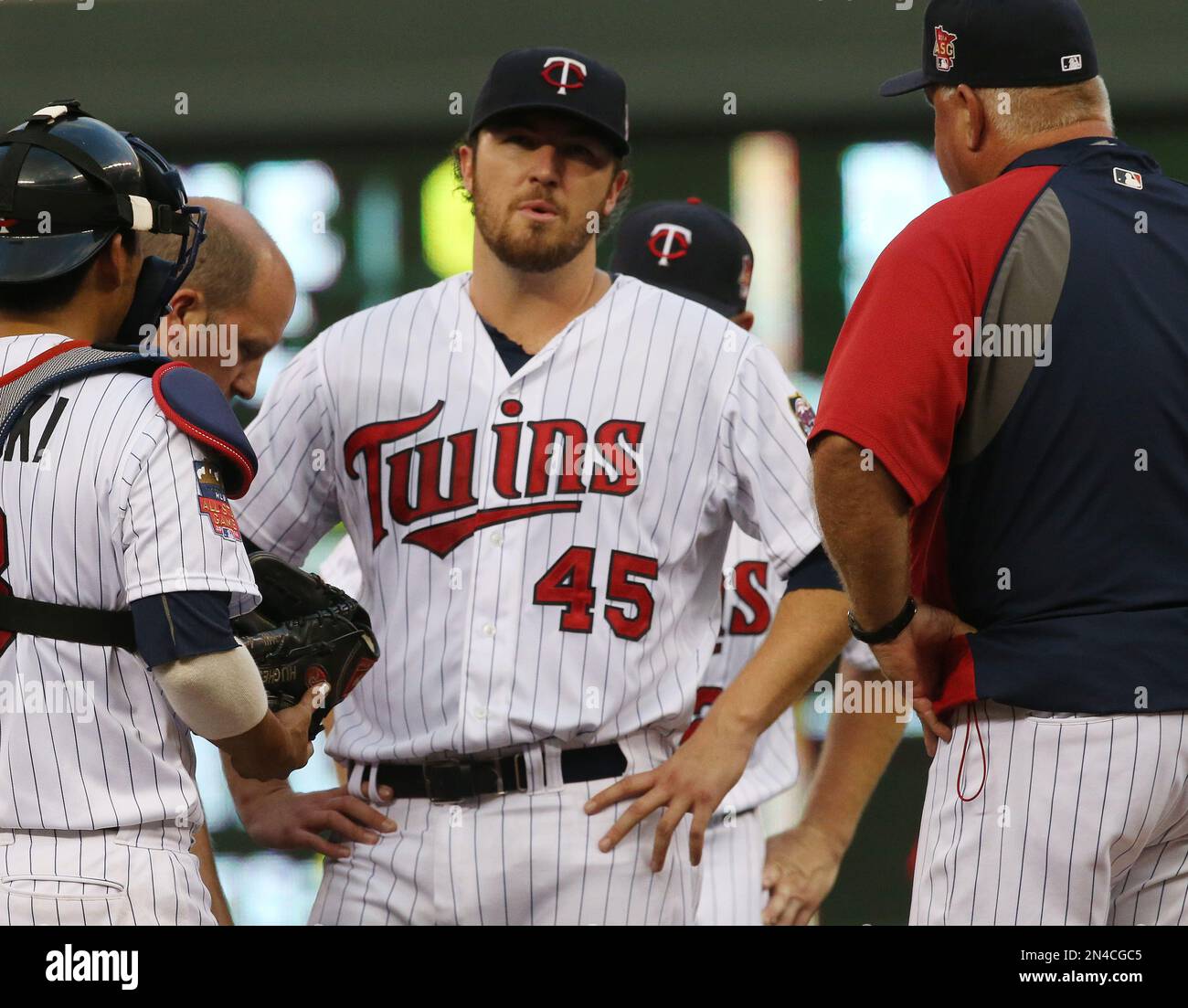 Minnesota Twins pitcher Phil Hughes (45) is checked after being hit in ...