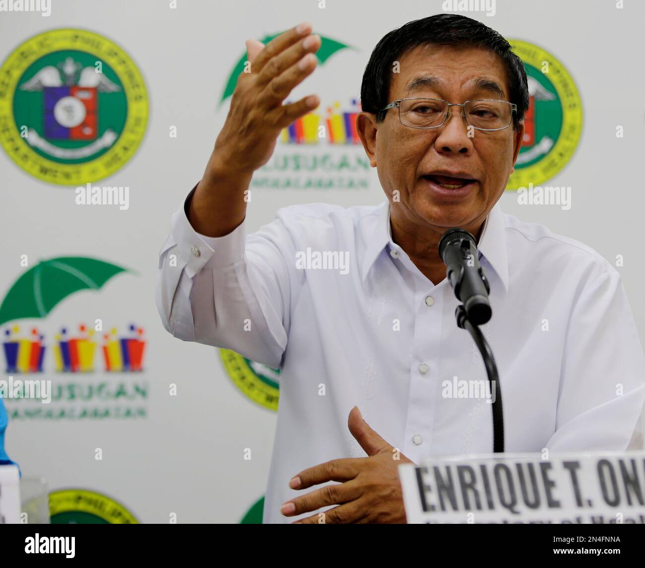 Philippine Health Secretary Enrique Ona gestures during a news ...