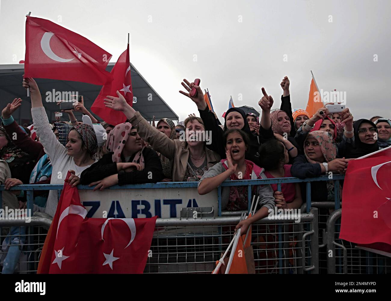 Supporters cheer as Turkey's Prime Minister Recep Tayyip Erdogan speaks ...