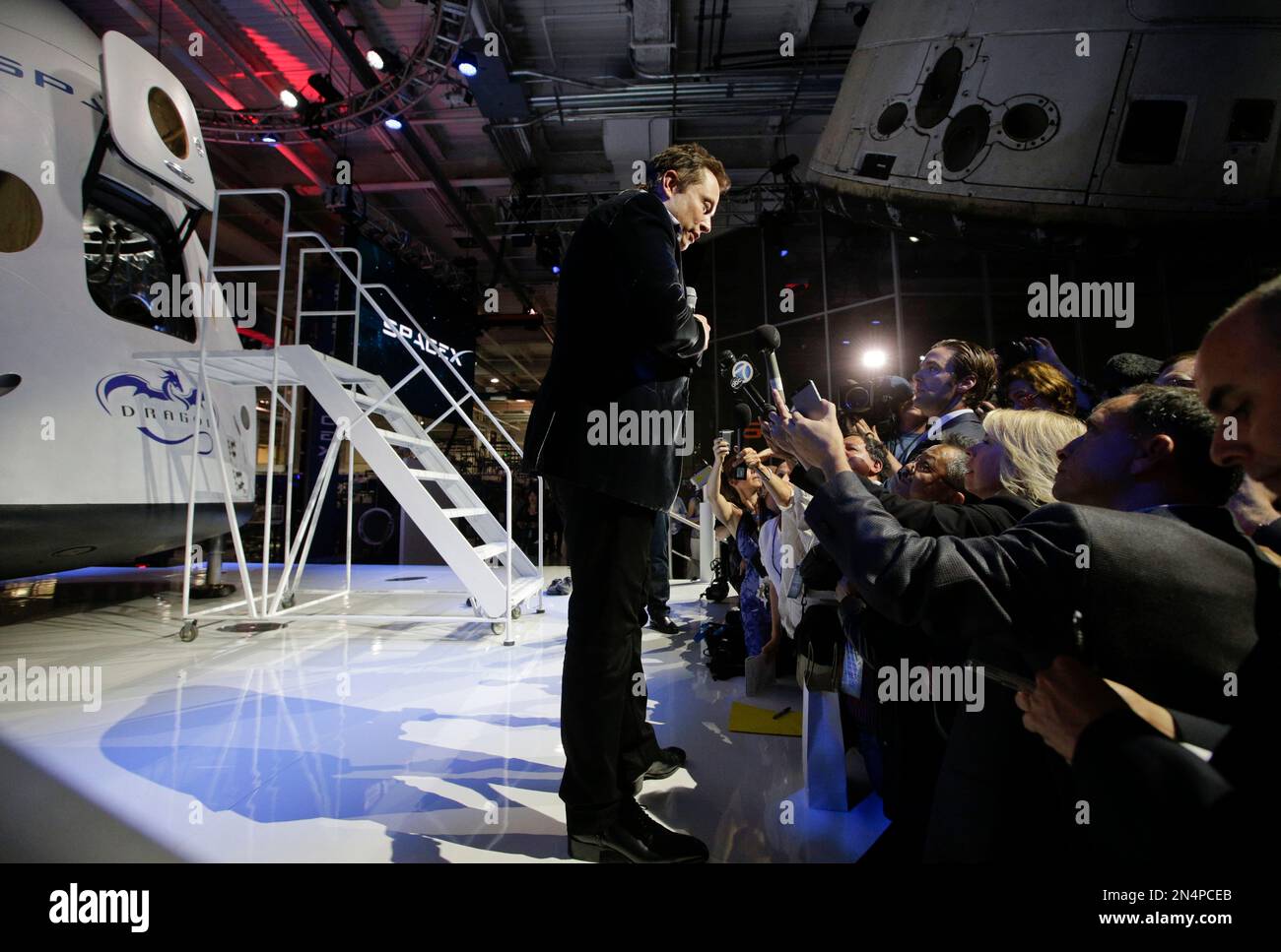 Elon Musk, CEO and CTO of SpaceX, answers questions from the media in ...