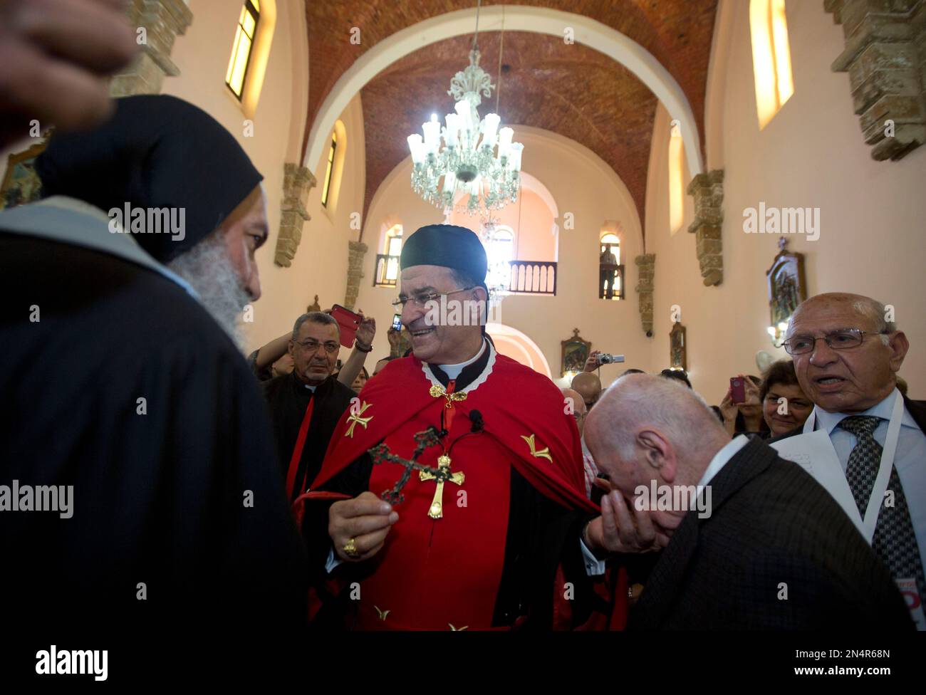 Cardinal Bechara Rai, a Maronite Catholic, center, is seen inside a ...