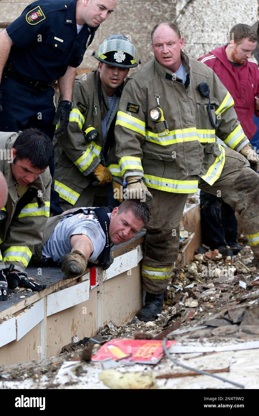 FILE - In this May 20, 2013 file photo, Moore firefighters from left ...