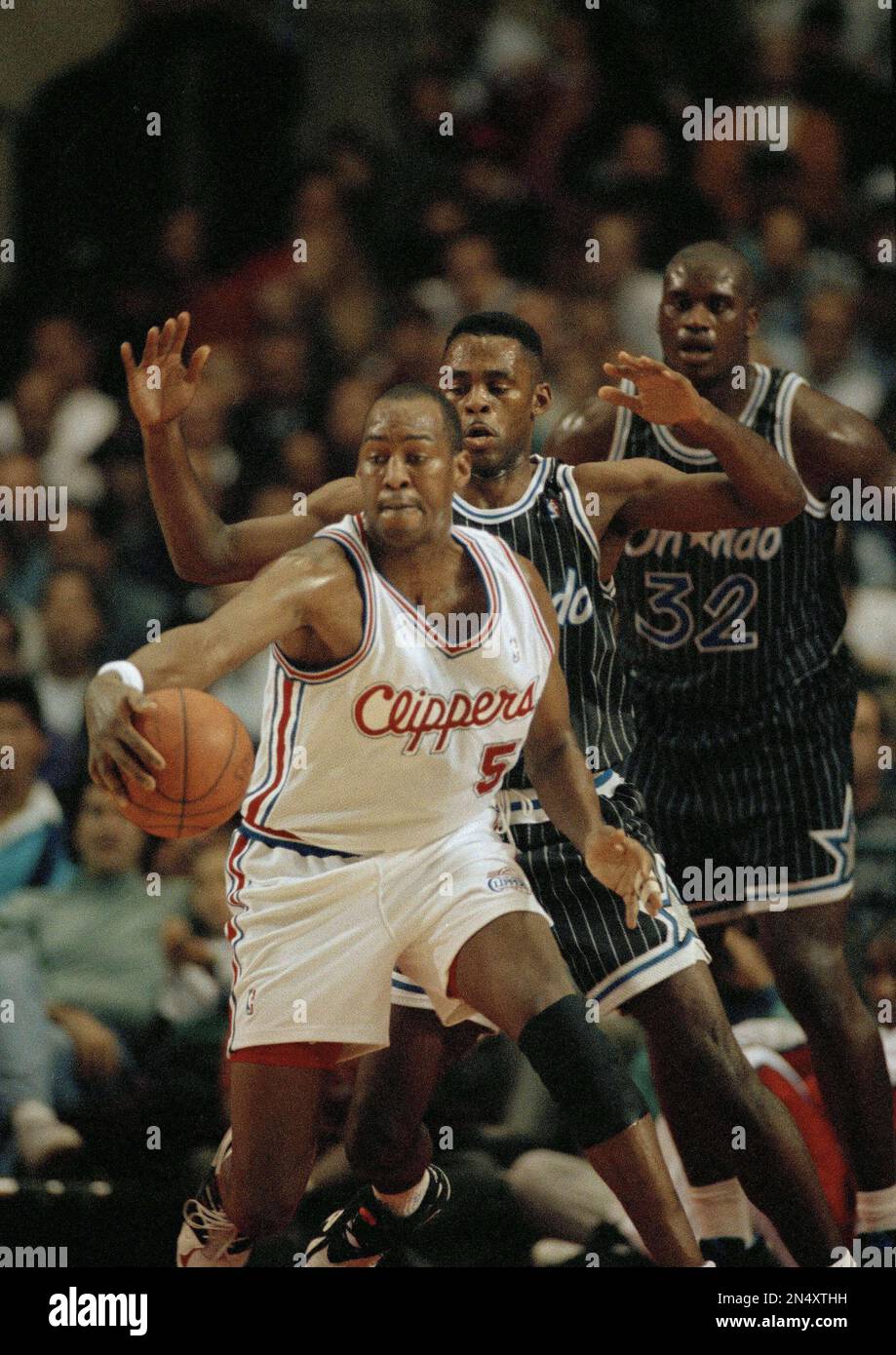 Danny Manning (5) of the Los Angeles Clippers, takes control of the ...