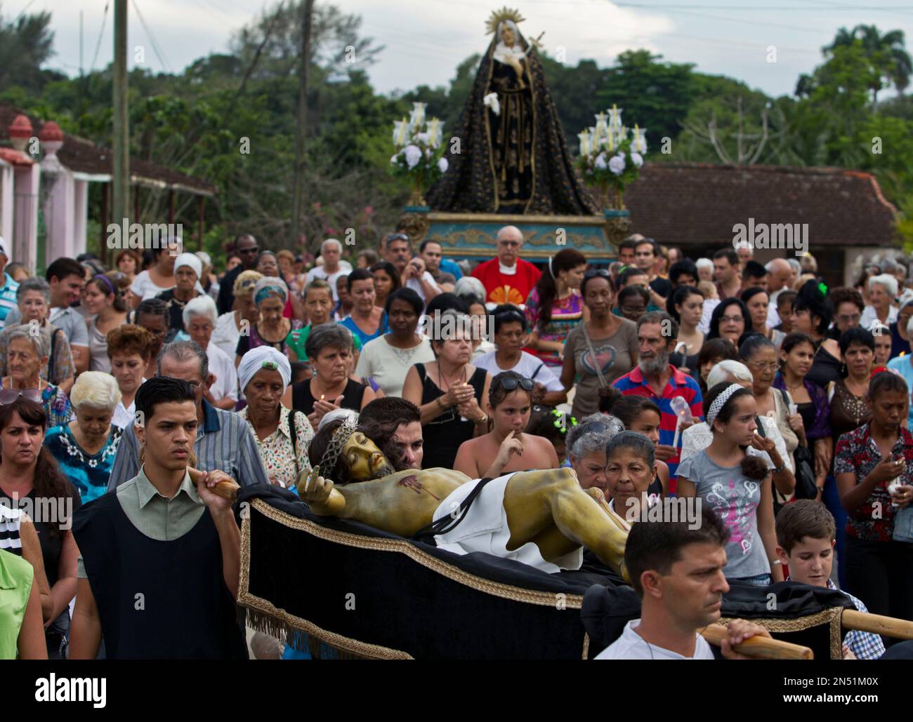 Pilgrims carry a statue of Jesus during a Holy Week procession on Good ...