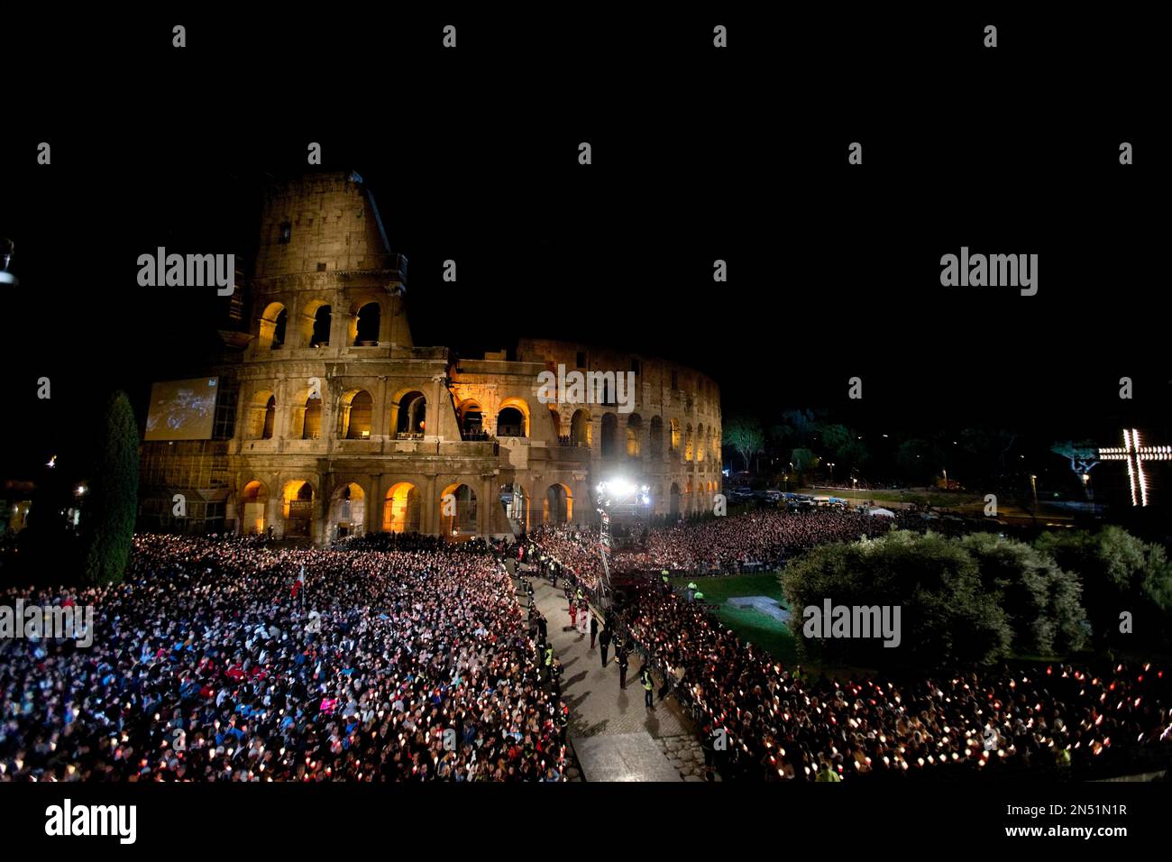 Faithful attend the Via Crucis (Way of the Cross) torchlight procession ...