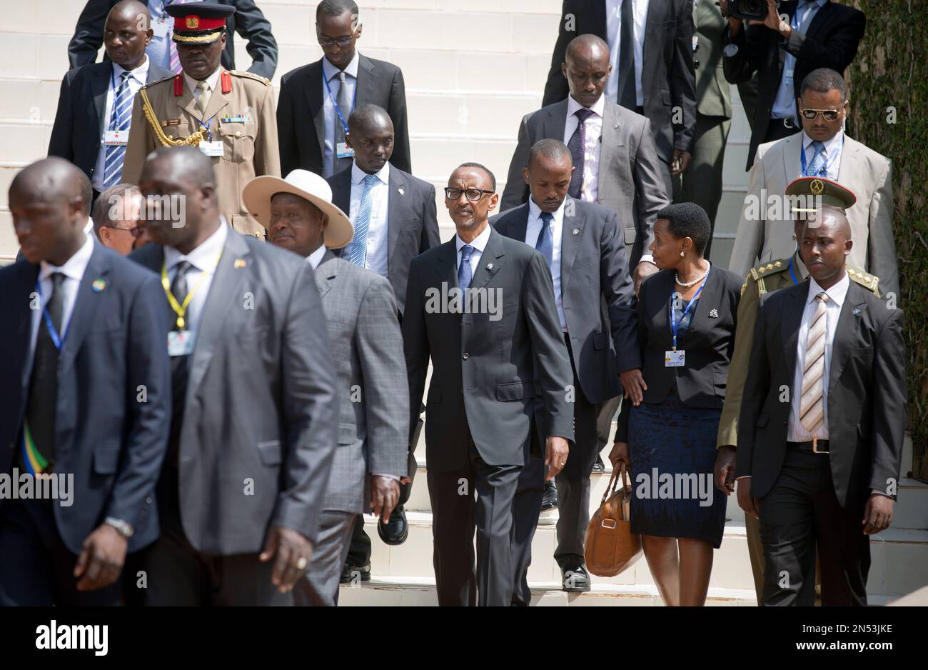 Rwandan President Paul Kagame, center, Uganda's President Yoweri Museveni, center left, and ...