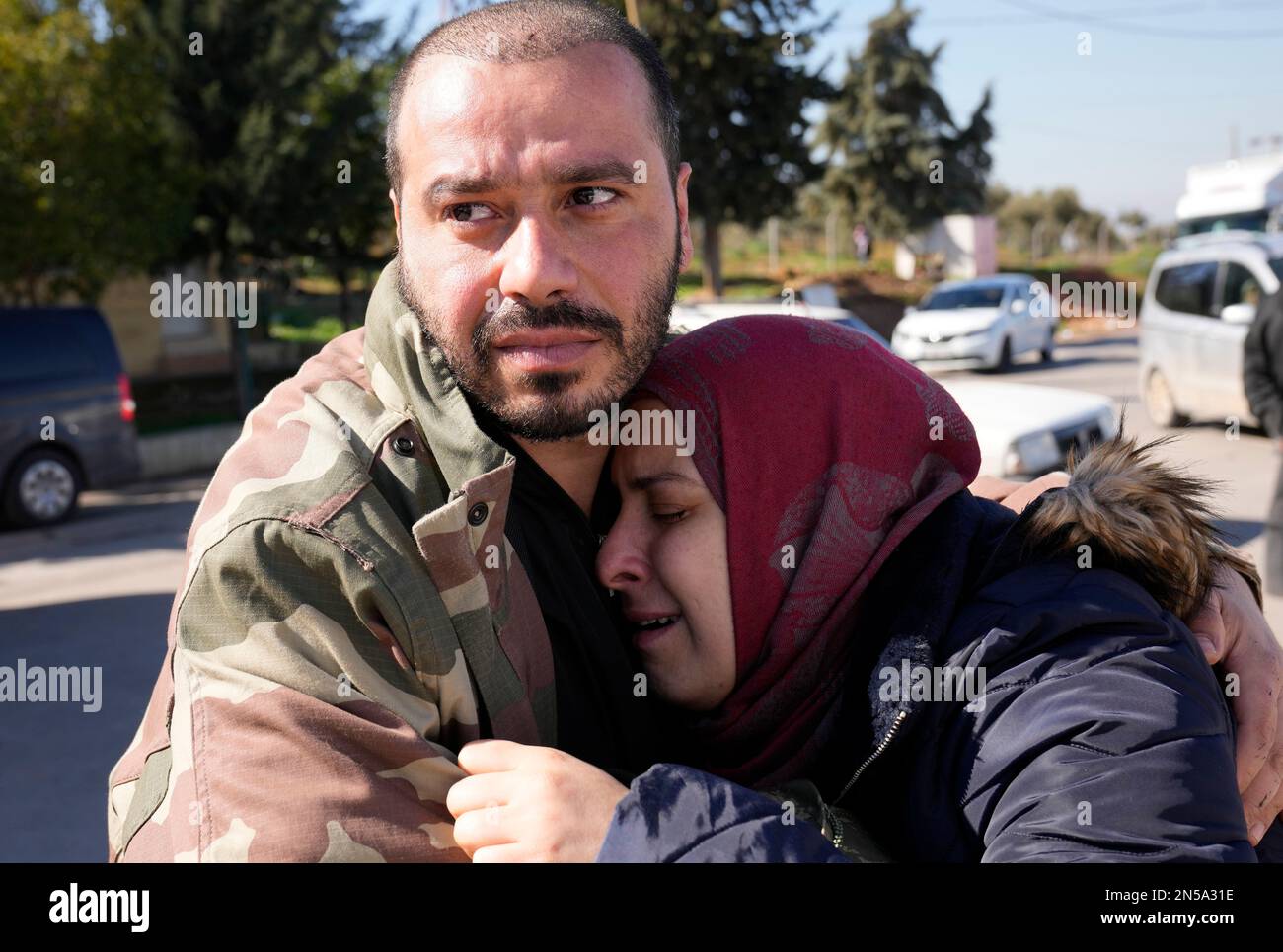 A Syrian couple mourns the loss of their daughter as her body is ...
