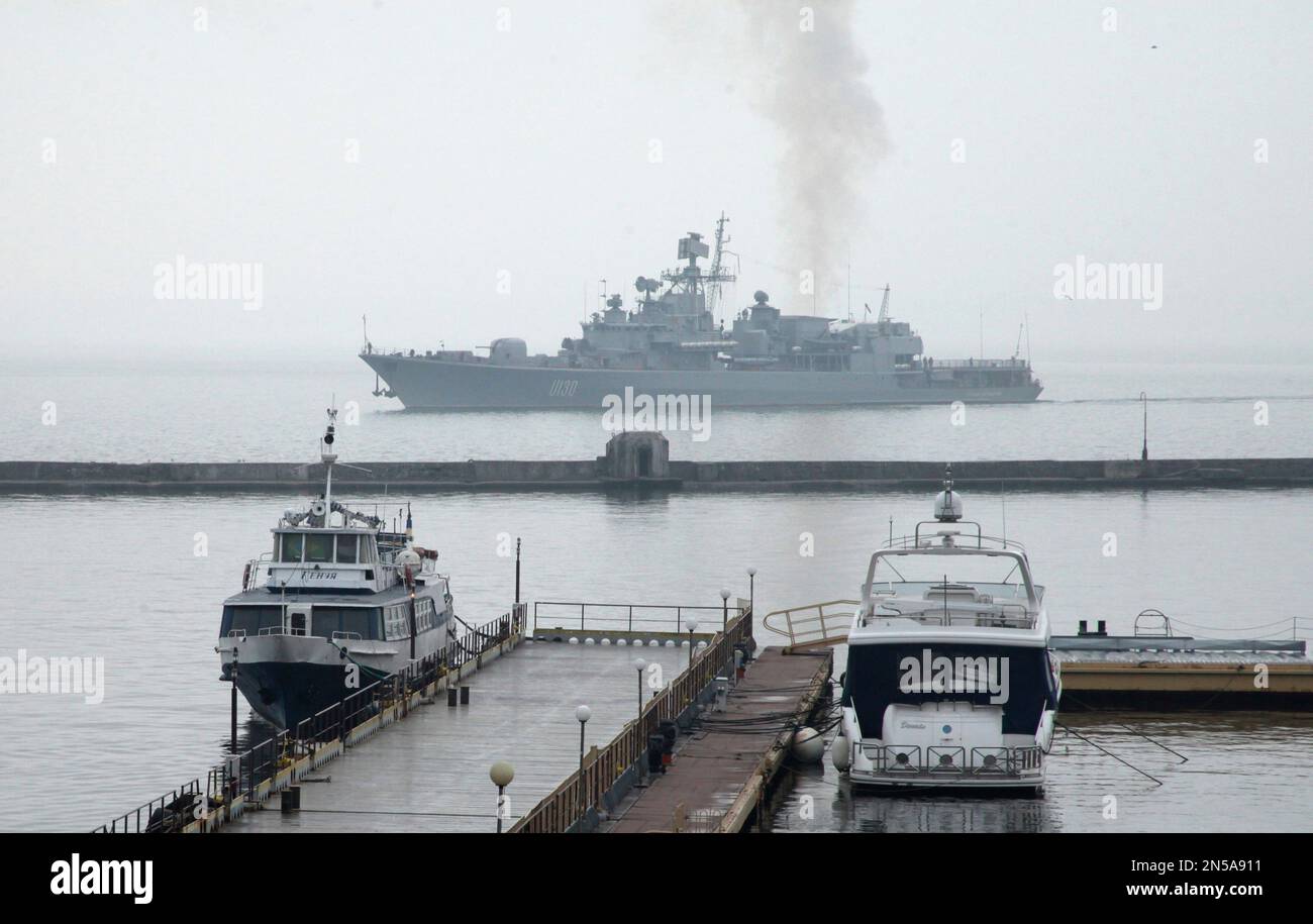 Ukraine frigate Hetman Sahaydachy, background, enters waters of the ...