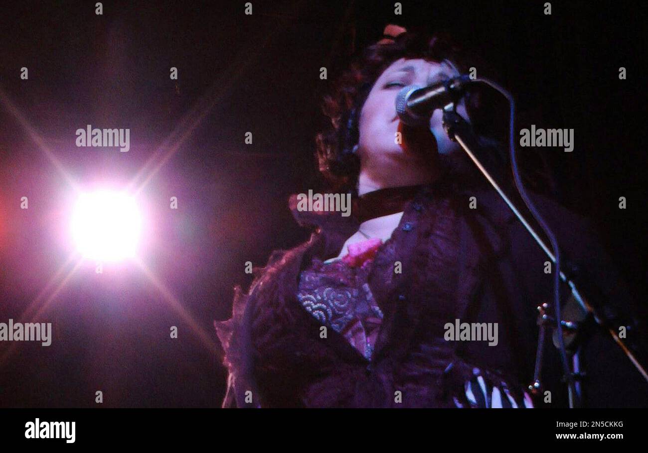 The burleslesque performer known as "Mama Dixie" sings during a ...