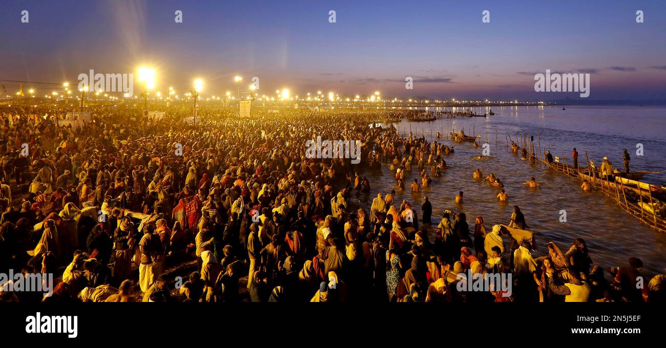 Hindu devotee throng Sangam, confluence of Hindu holy rivers of Ganges ...