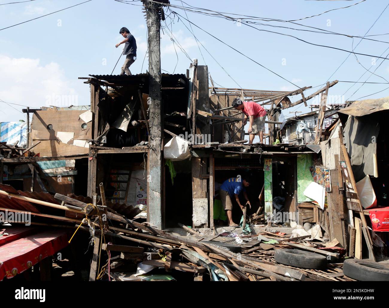 Residents "self-demolish" their shanties to save housing materials as ...