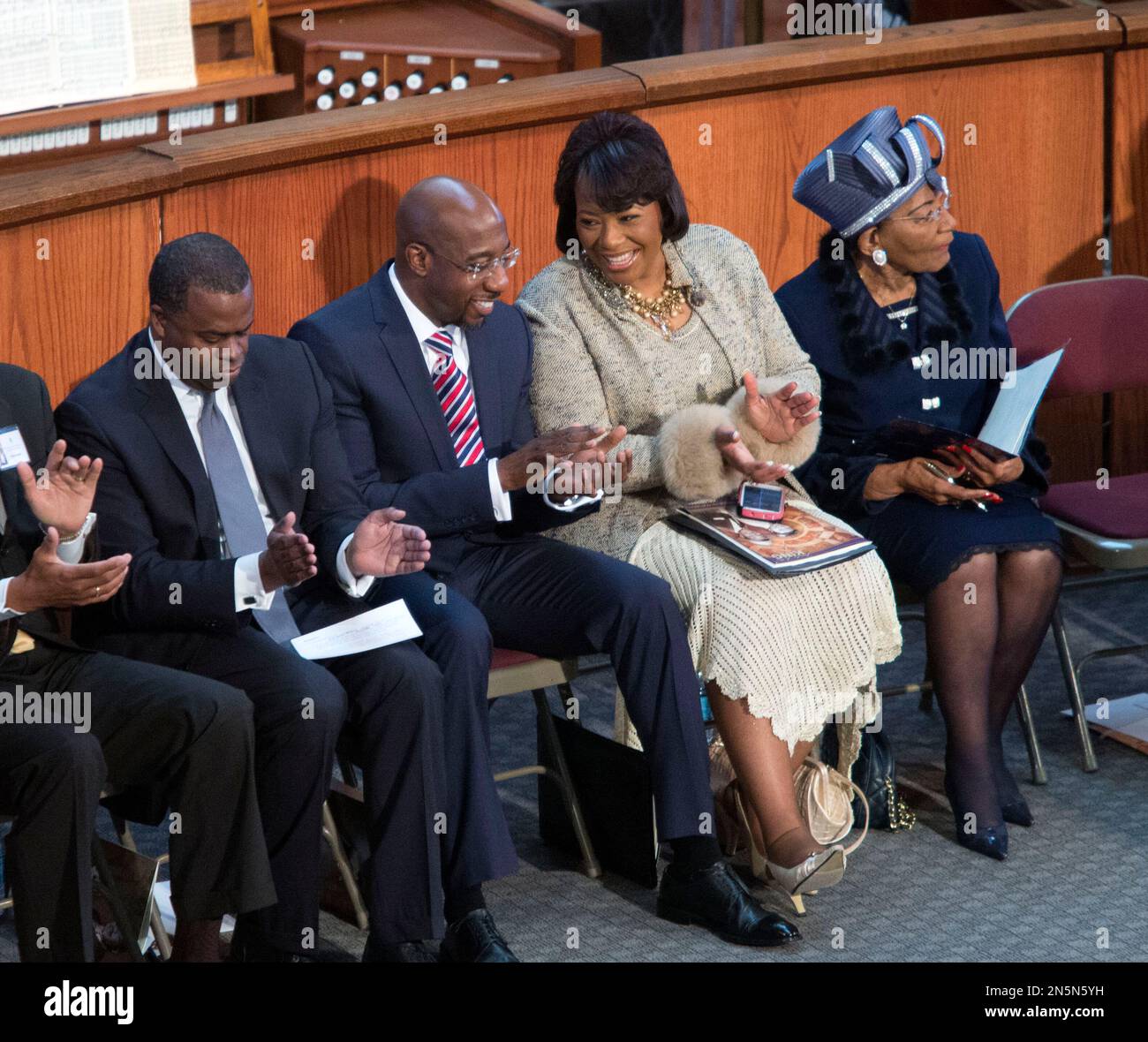 Bernice King, second from right, talks with pastor Raphael Warnock ...