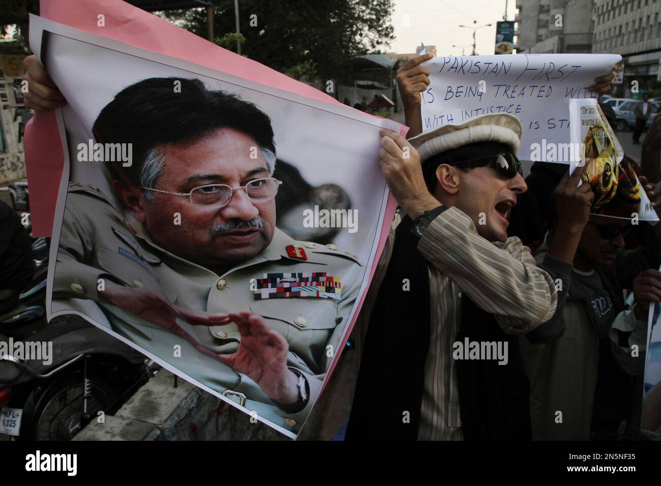 A supporter of Pakistan's former president and military ruler Pervez ...