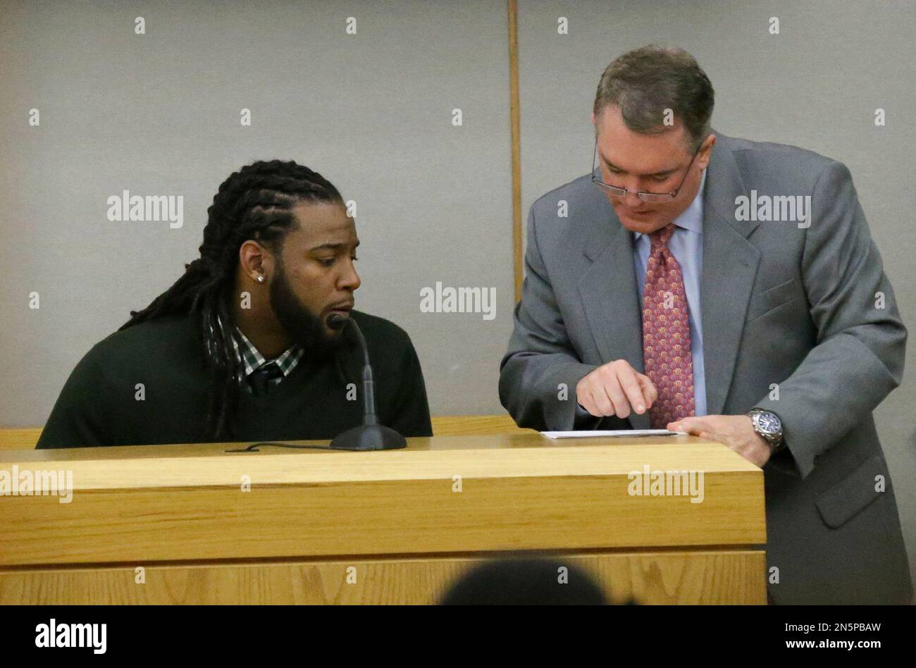 Dallas Cowboys defensive back Danny McCray, left, listens to a question ...