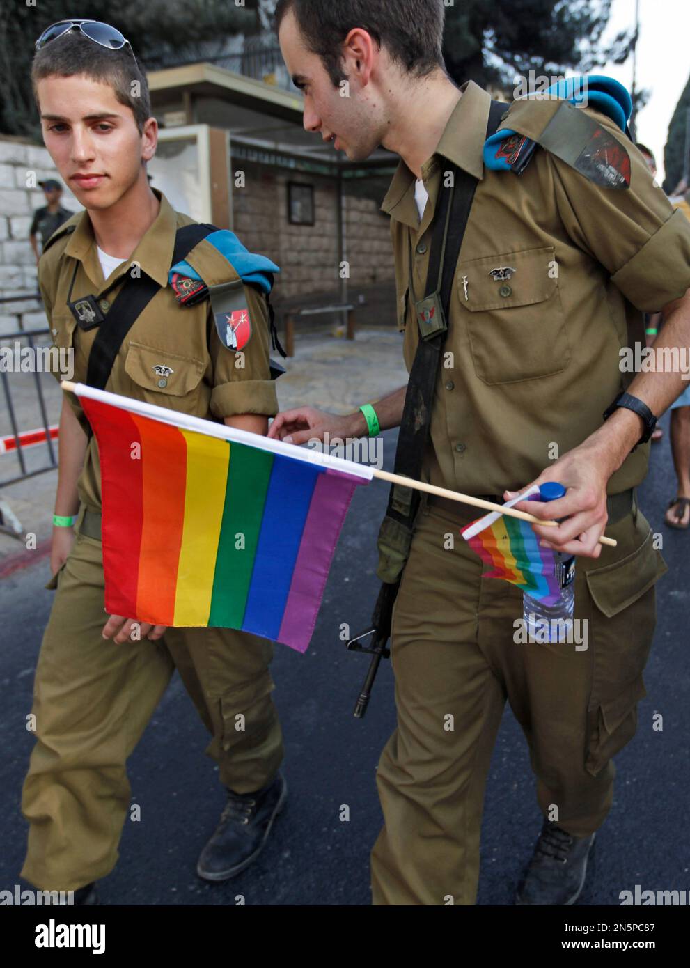FILE - In this June 25, 2009 file photo, An Israeli soldier holds a ...