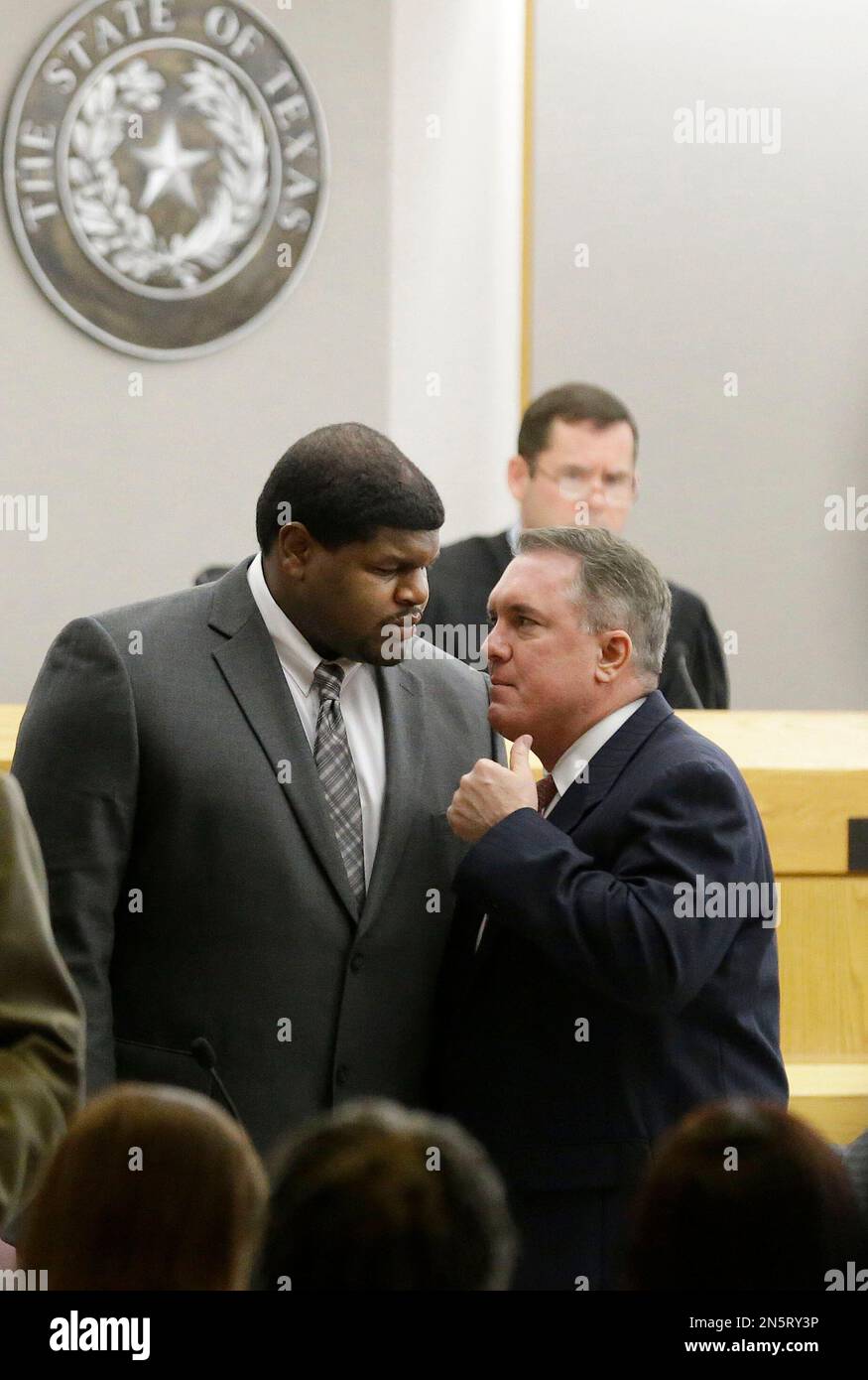 Former Dallas Cowboys Josh Brent talks with his attorney George Milner ...