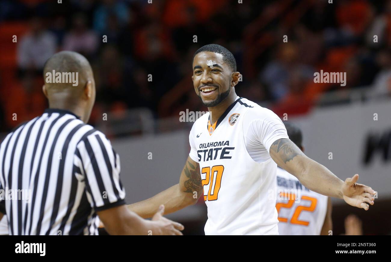 Oklahoma State post Michael Cobbins (20) talks with an official during ...