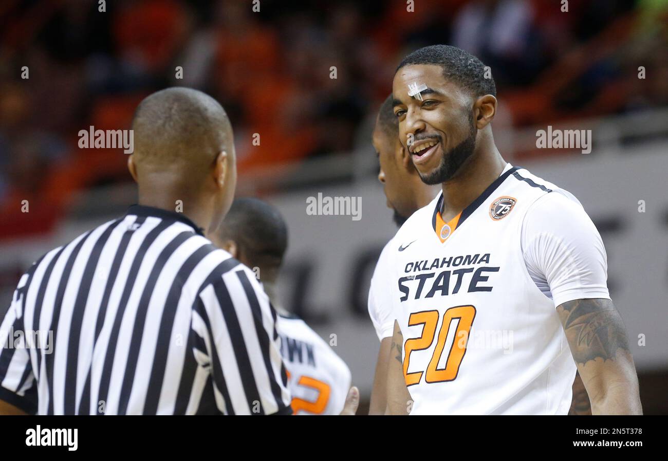 Oklahoma State post Michael Cobbins (20) talks with an official during ...