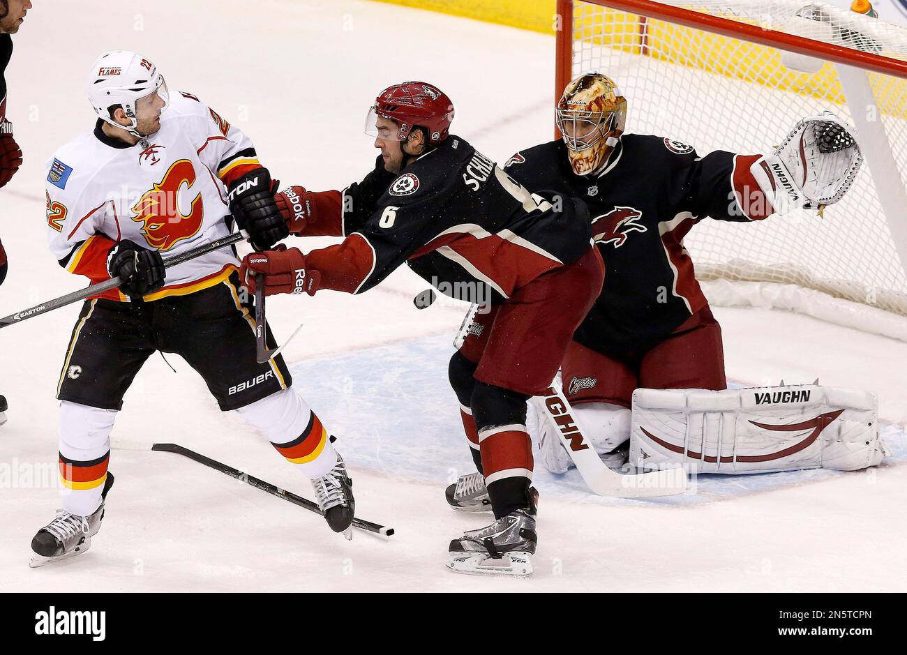 Phoenix Coyotes' Thomas Greiss, right, of Germany, makes a save on a ...