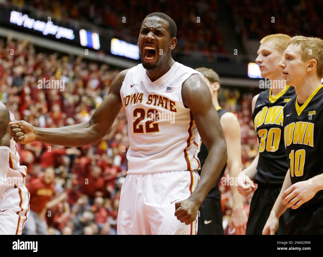Iowa State forward Dustin Hogue (22) reacts in front of Iowa's Aaron ...