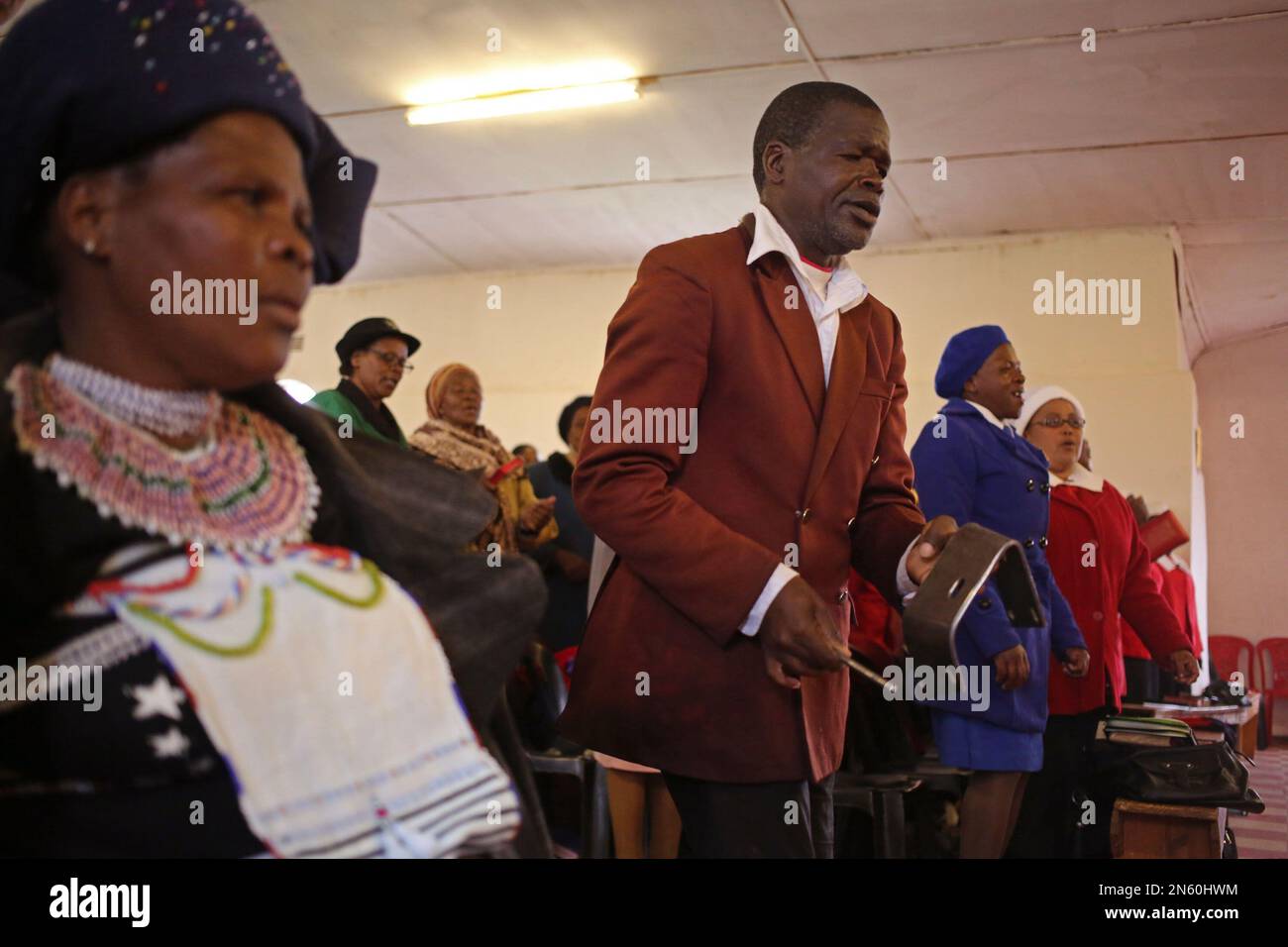 People sing after praying, for former South African president Nelson ...
