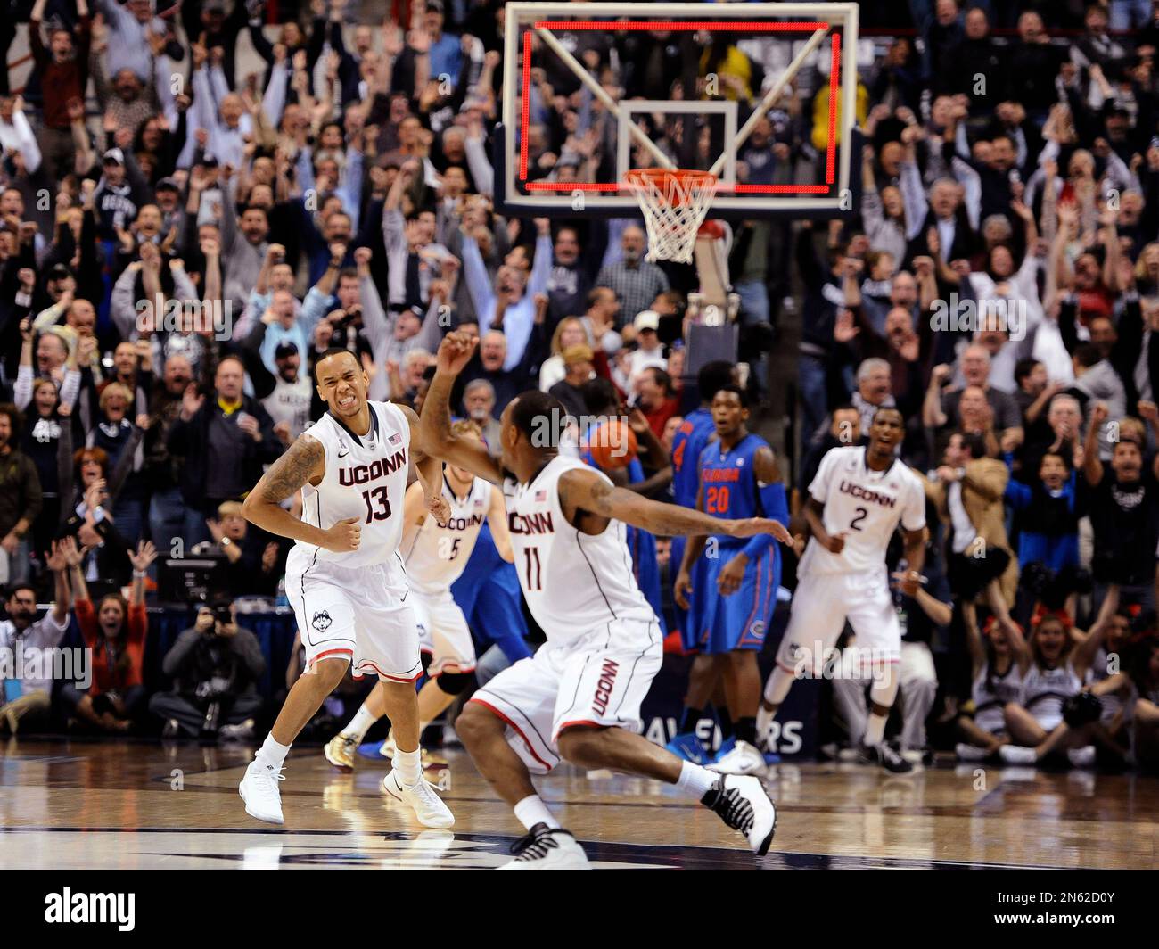 Connecticut's Shabazz Napier, left, and Ryan Boatright, right, react ...