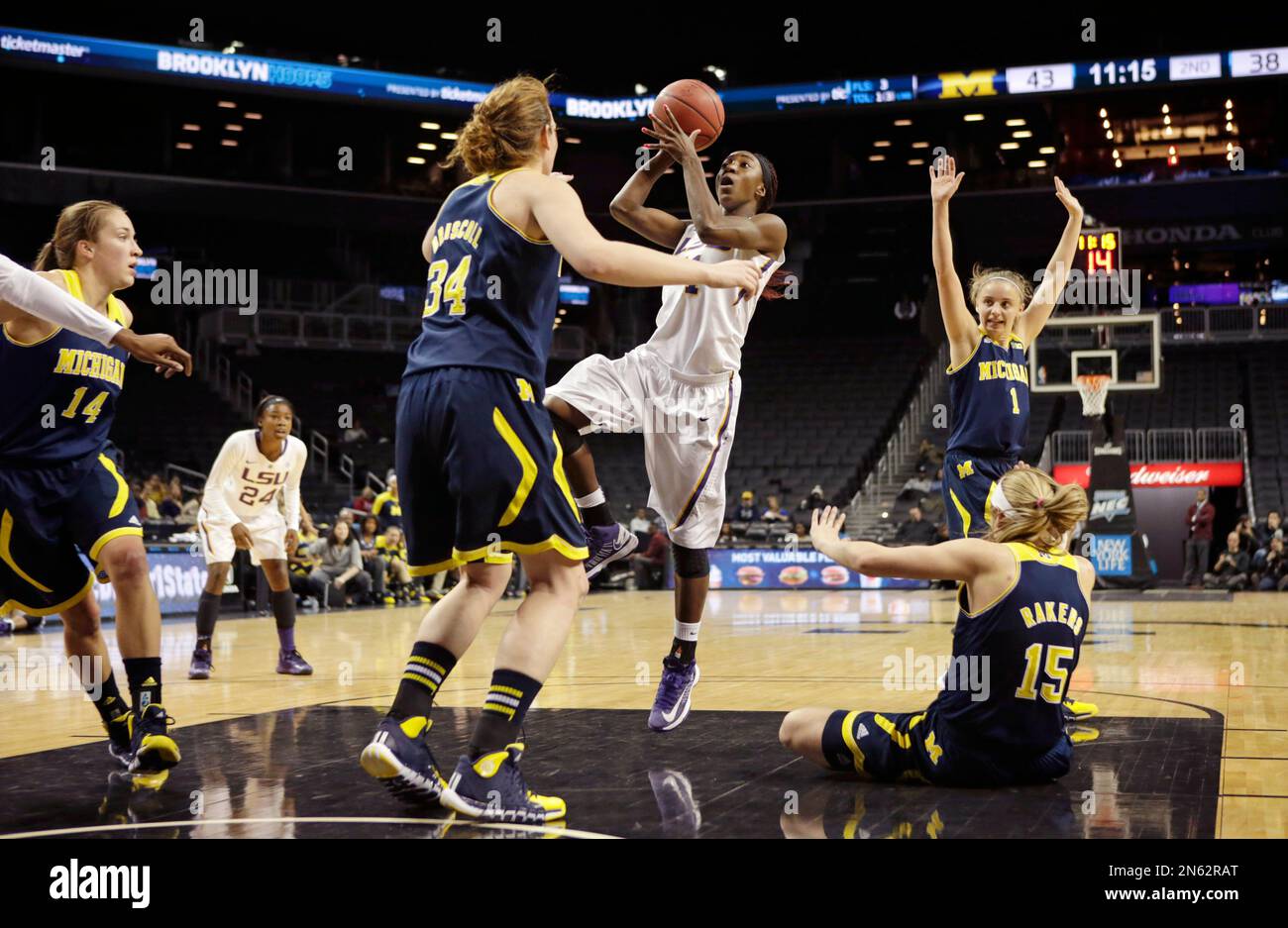 LSU guard Raigyne Moncrief (11) goes up for a layup as Michigan forward ...