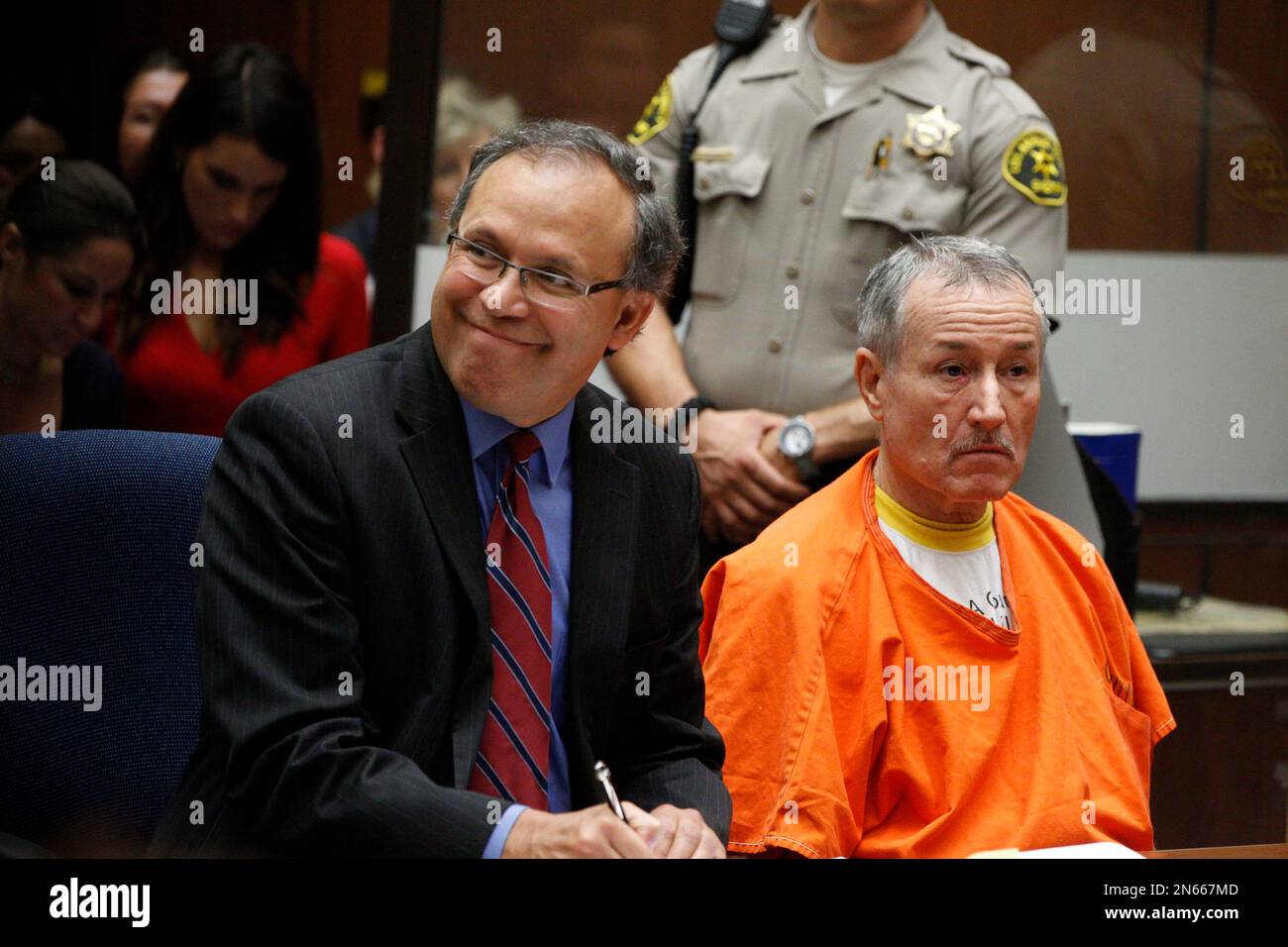 Attorney Manny Medrano, left, looks back at the prosecution, as his ...