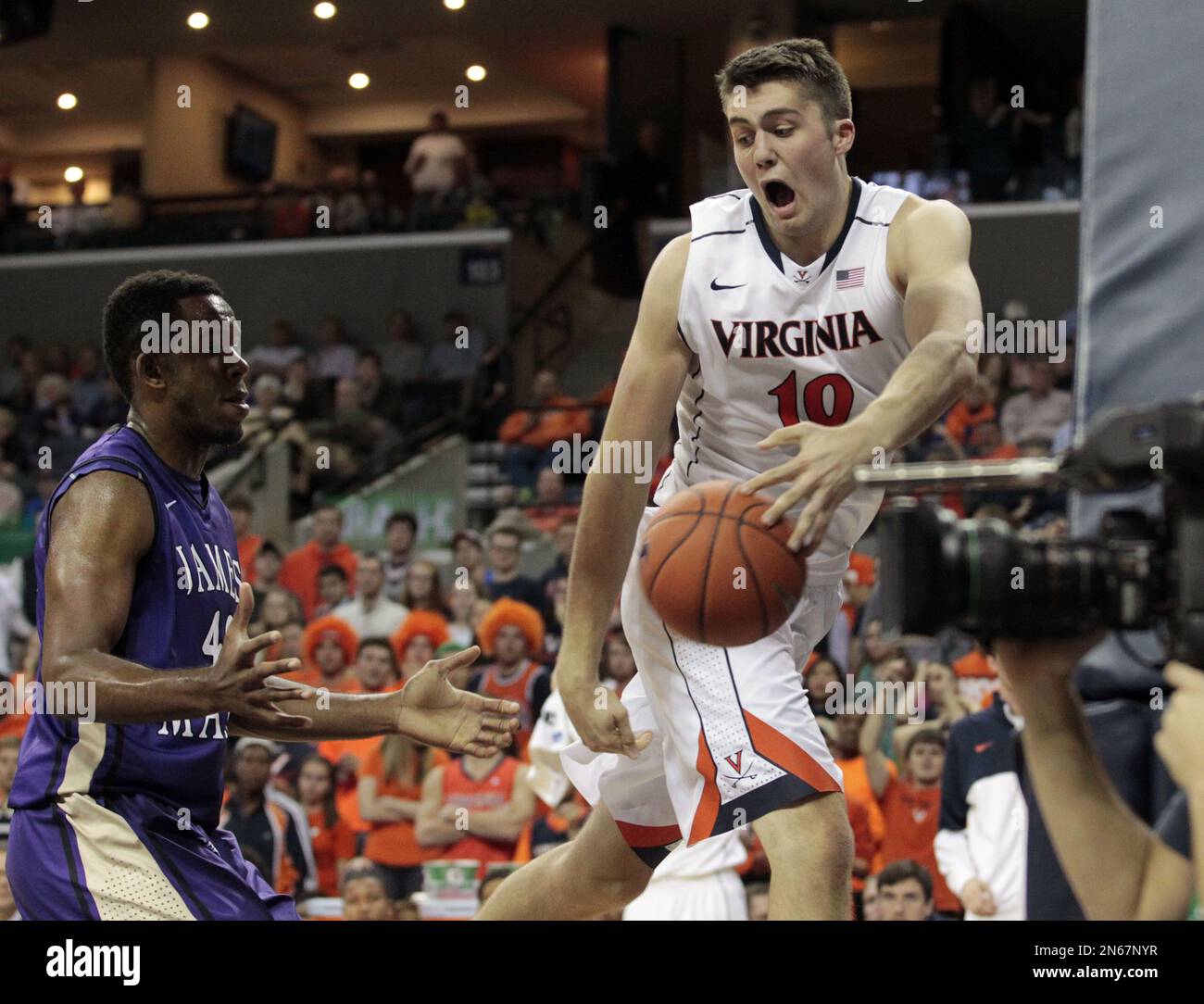 Virginia forward Mike Tobey (10) jumps to stop the ball from going out ...