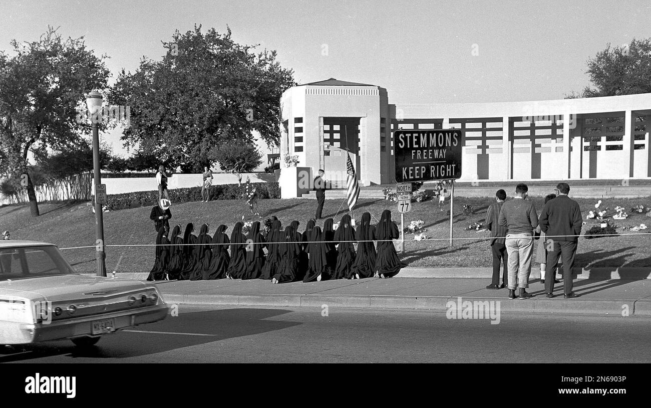 FILE - In this Nov. 25, 1963 file photo, Roman Catholic nuns kneel and ...
