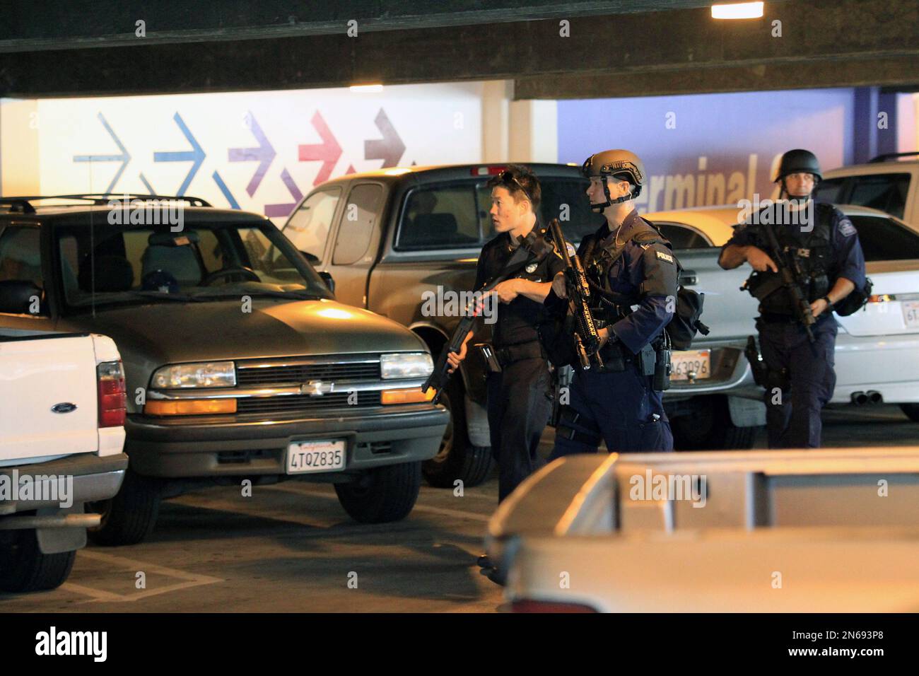SWAT officers search a parking structure during a security check at Los ...