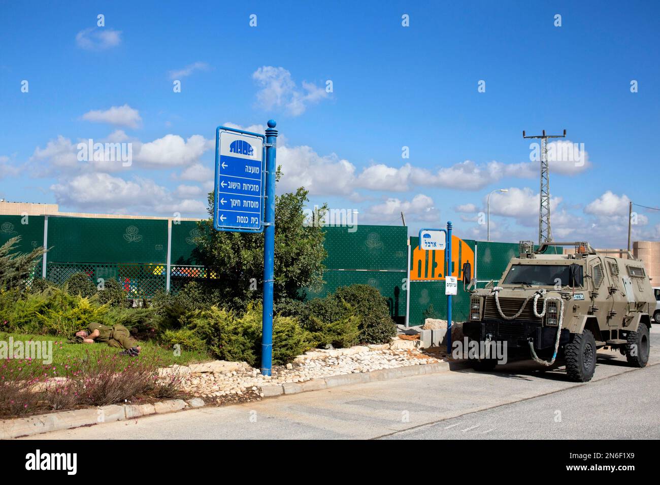An Israeli soldier rests in an armored vehicle in the West Bank Jewish ...