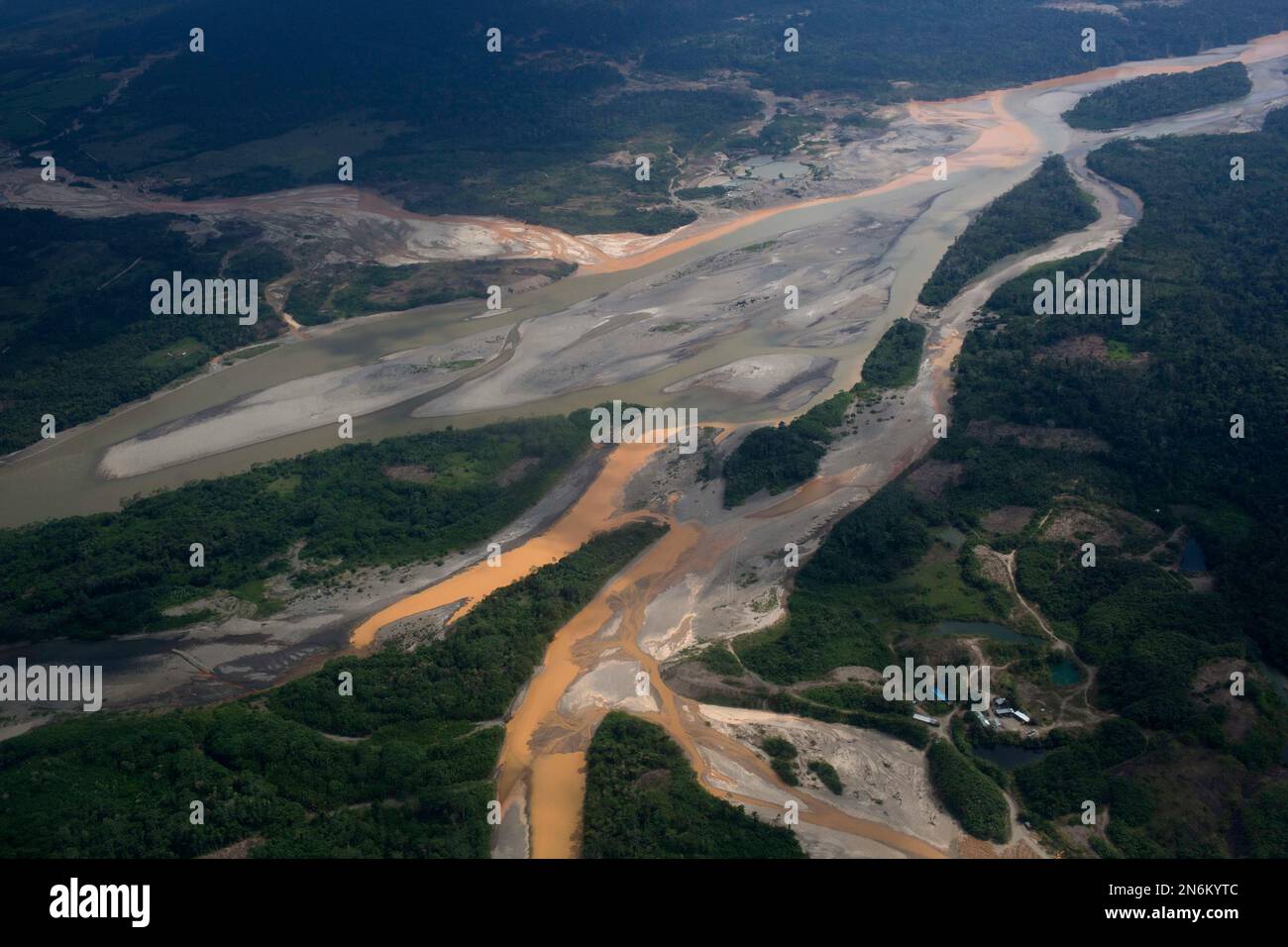 This Sept. 13, 2013 aerial photo shows a river polluted by waste from ...