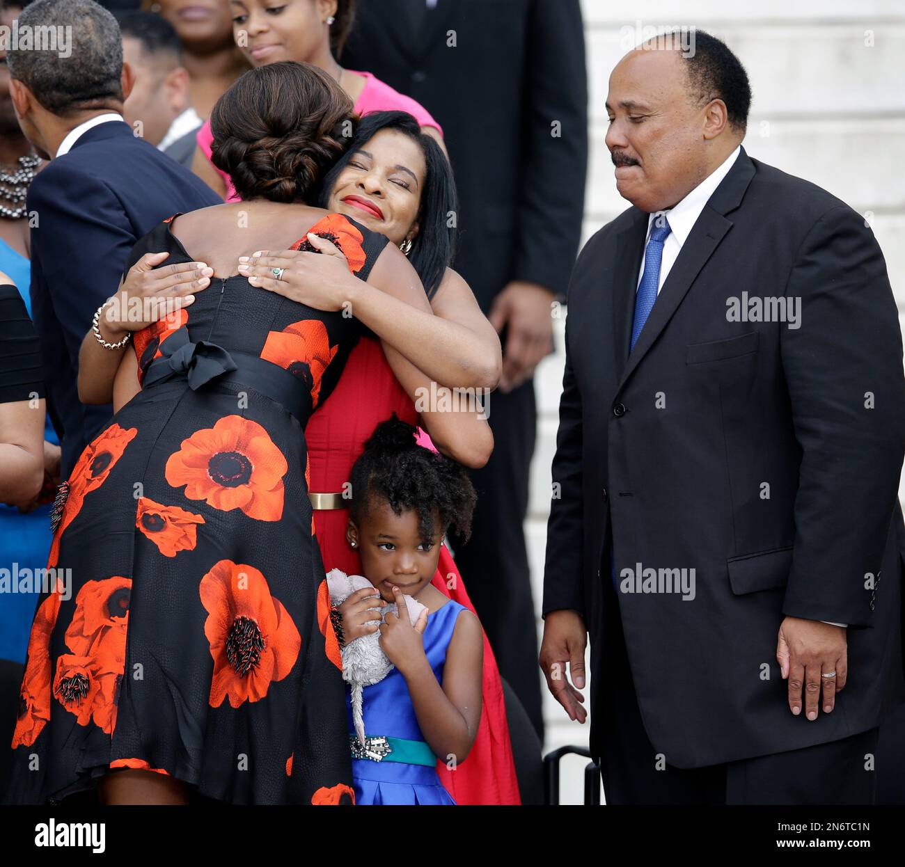 First lady Michelle Obama hugs Arndrea Waters wife of Martin Luther ...