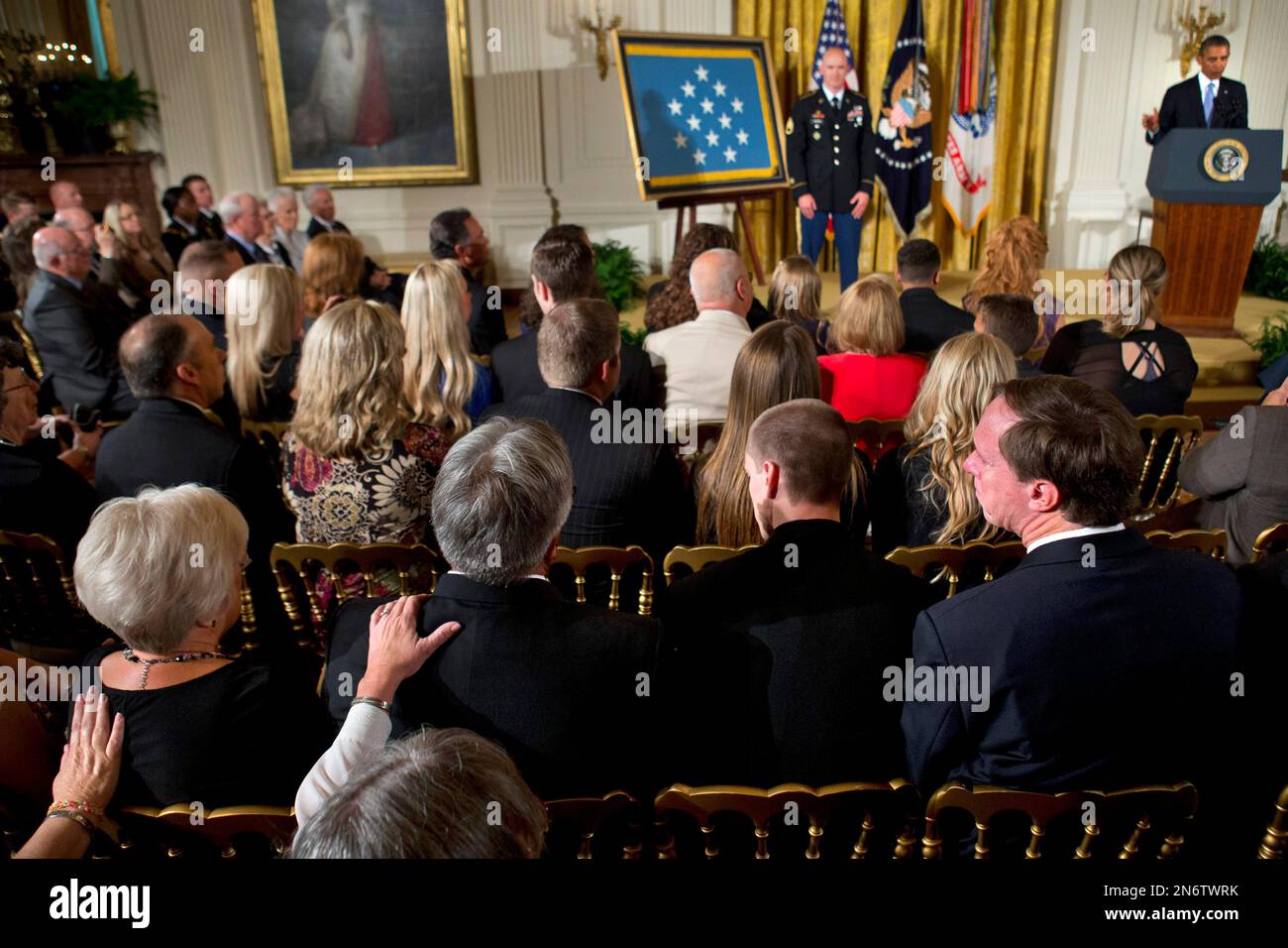 Family of fallen service members comfort each other as President Barack ...