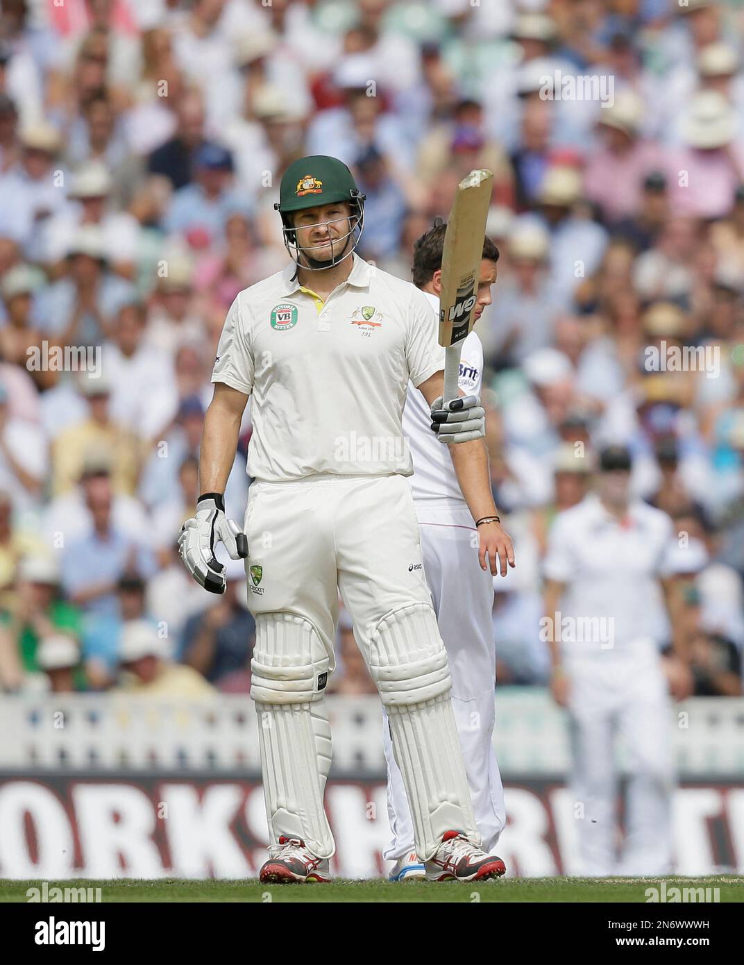 Australia's Shane Watson raises his bat to acknowledge the crowd after ...