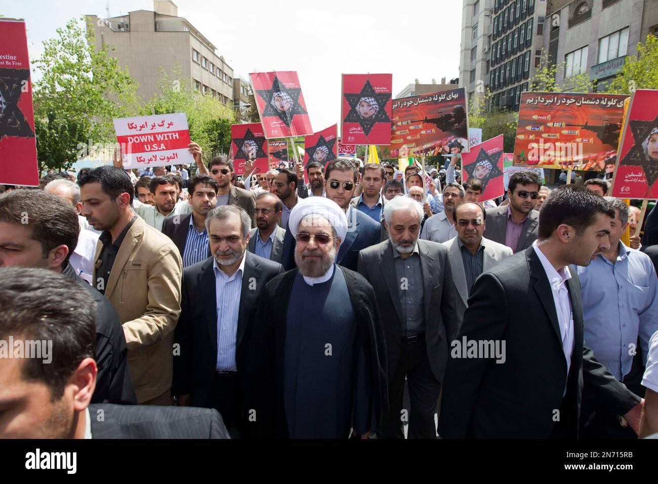 Iranian President elect Hasan Rouhani, center with white turban ...