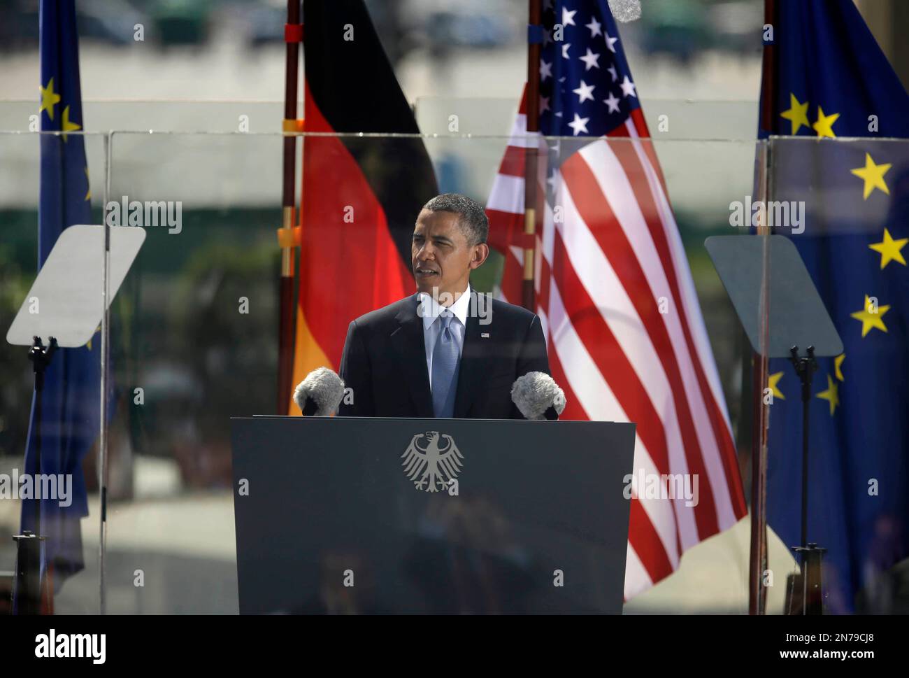 President Barack Obama speaks in front of the iconic Brandenburg Gate ...