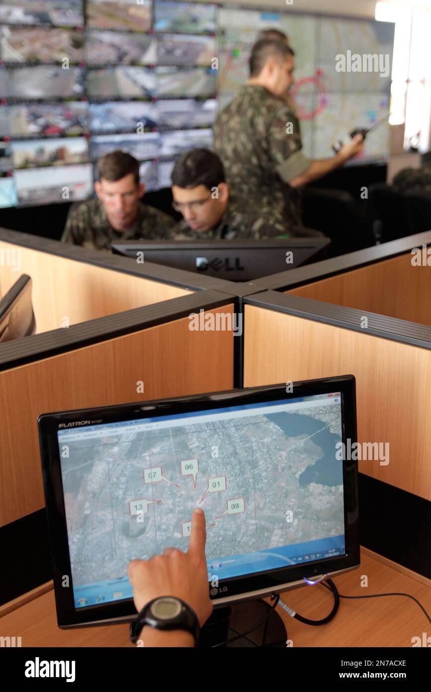 Military members work in a command center that oversees security for ...